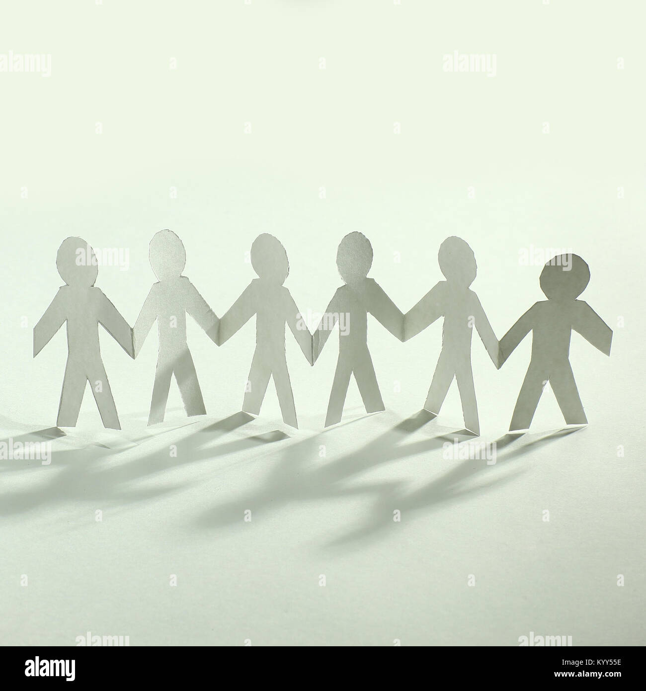 concept of teamwork.team paper men standing Stock Photo - Alamy