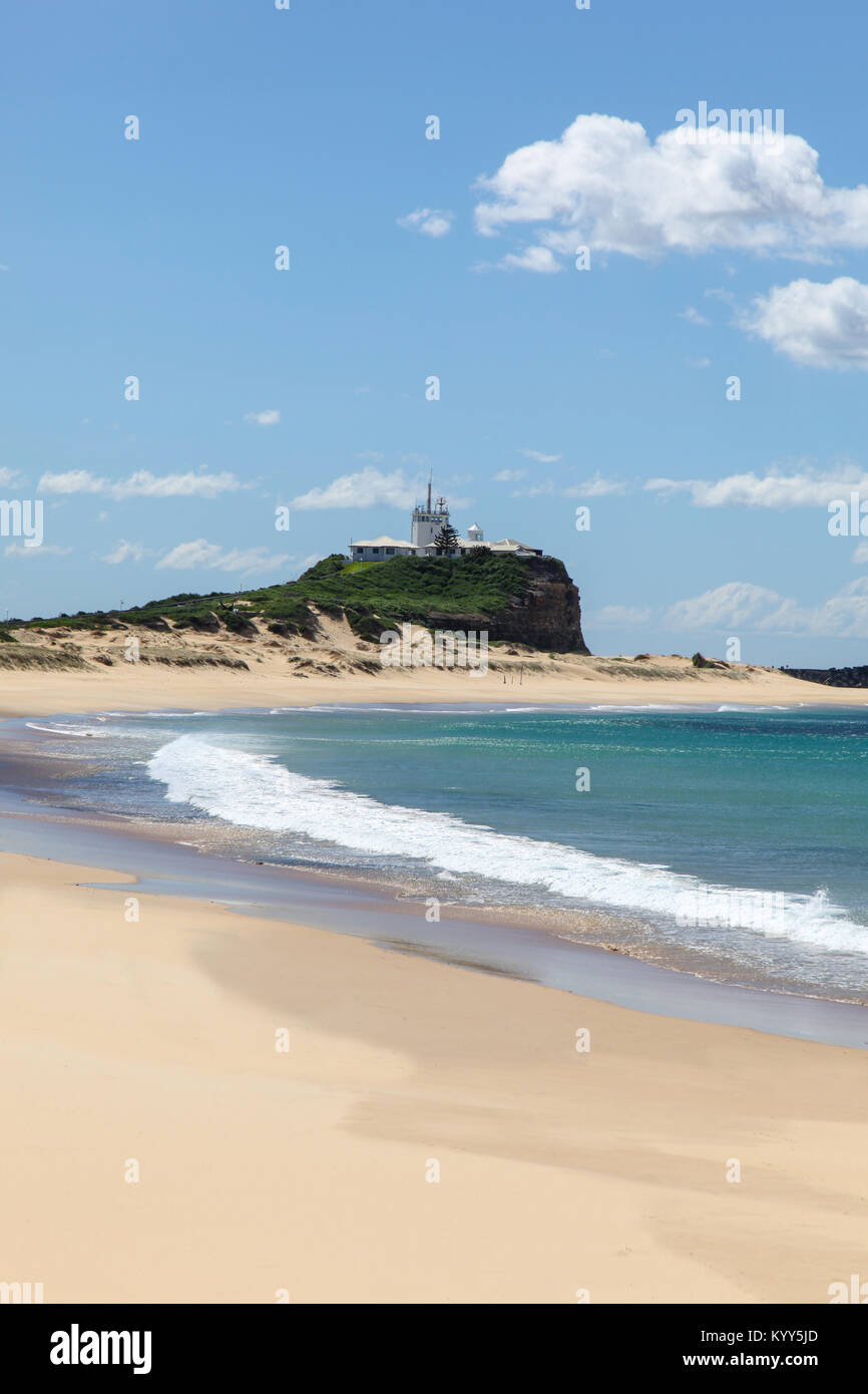 A sunny day at Nobbys Beach showing the nice sand waves and Nobbys ...