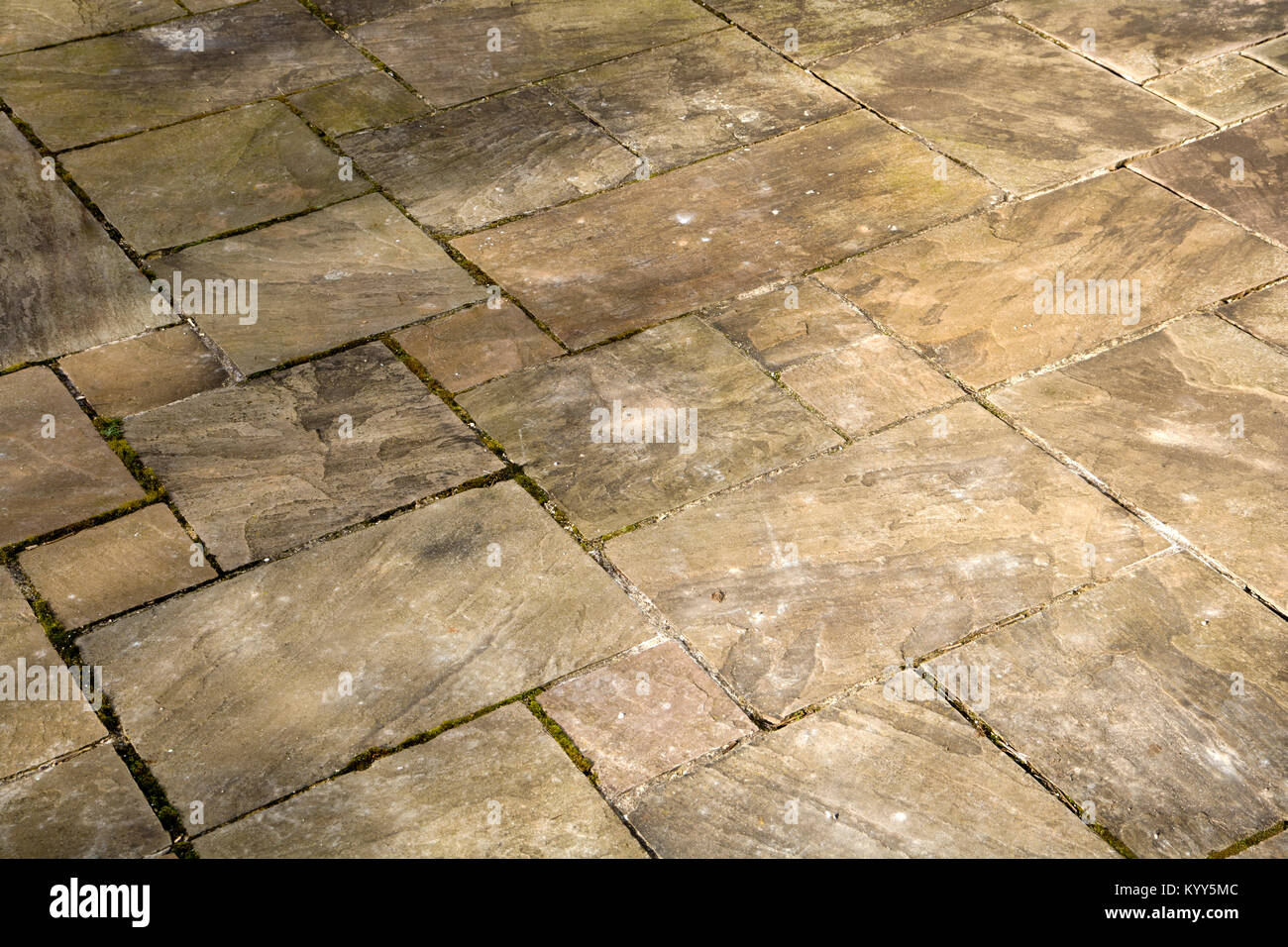 Weathered limestone patio flagstone pattern Stock Photo - Alamy