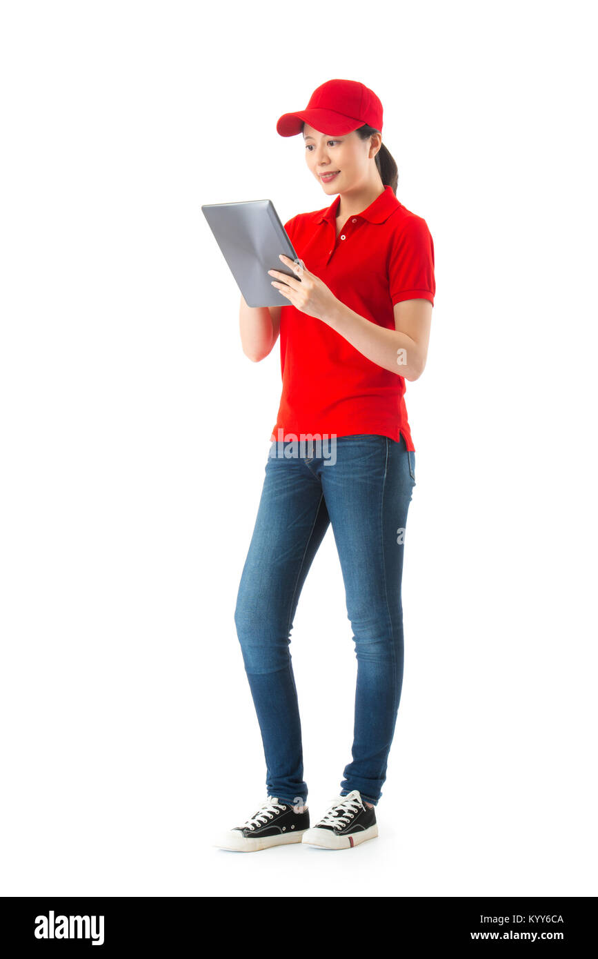 professional young female delivery officer using mobile pad computer ...