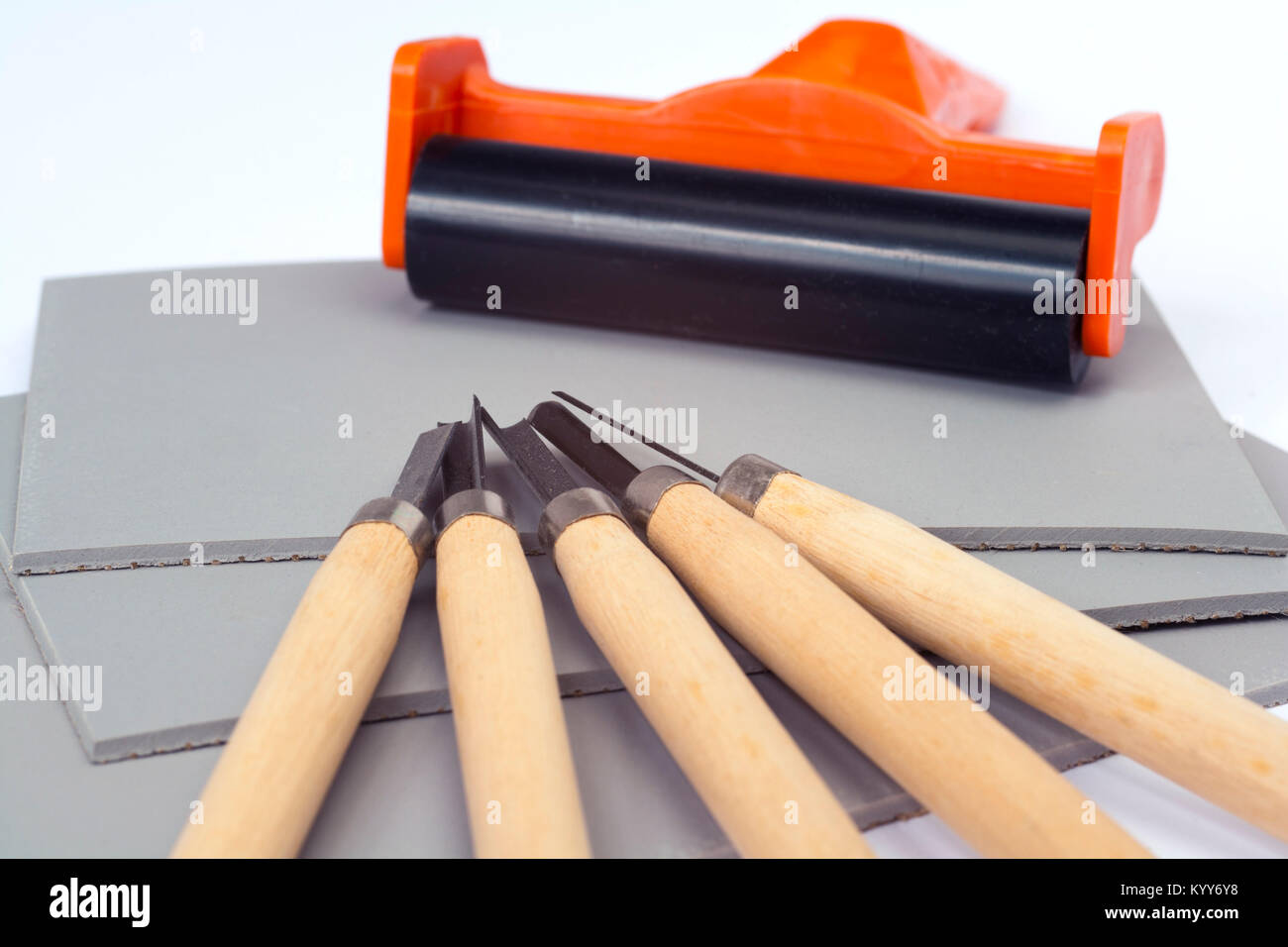 Art and crafts - linocut tools on white paper Stock Photo - Alamy