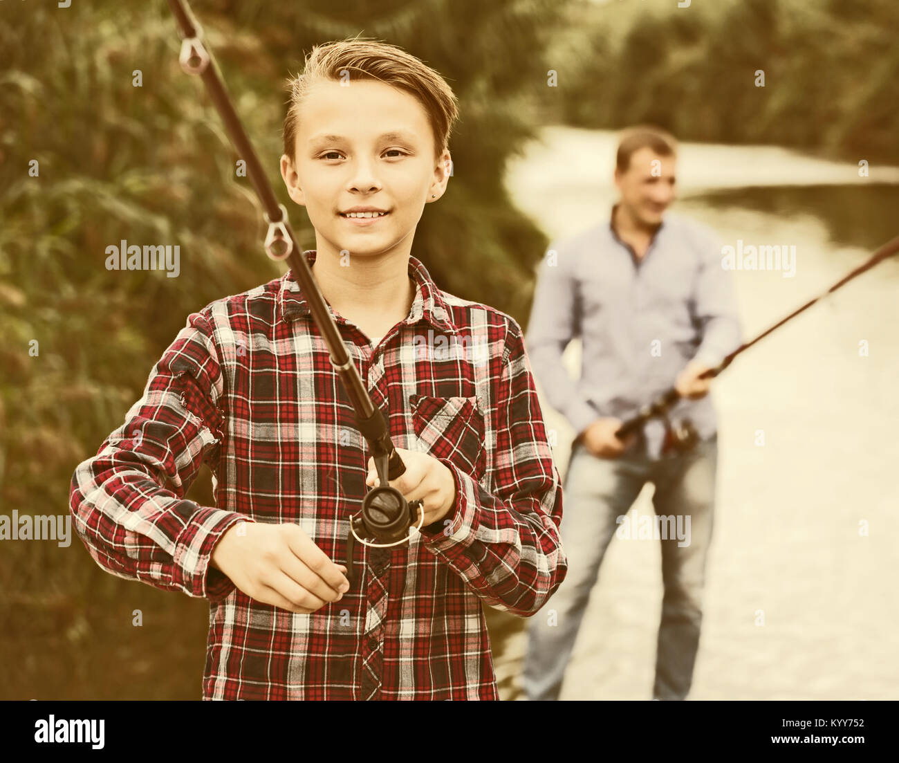 Boy holding fishing line hi-res stock photography and images - Alamy