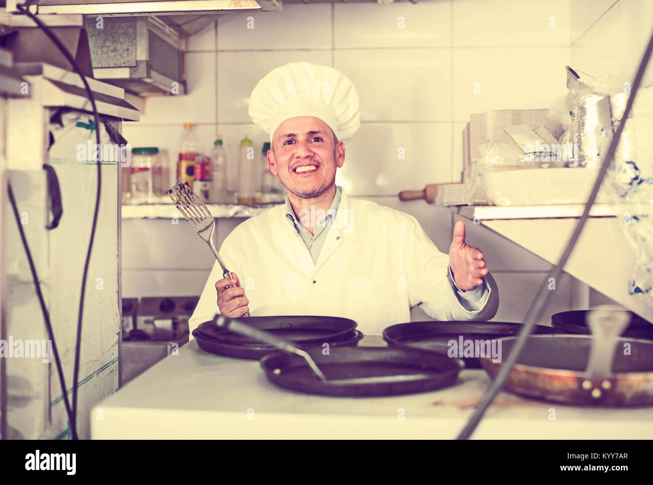 Friendly chef in uniform hi-res stock photography and images - Alamy