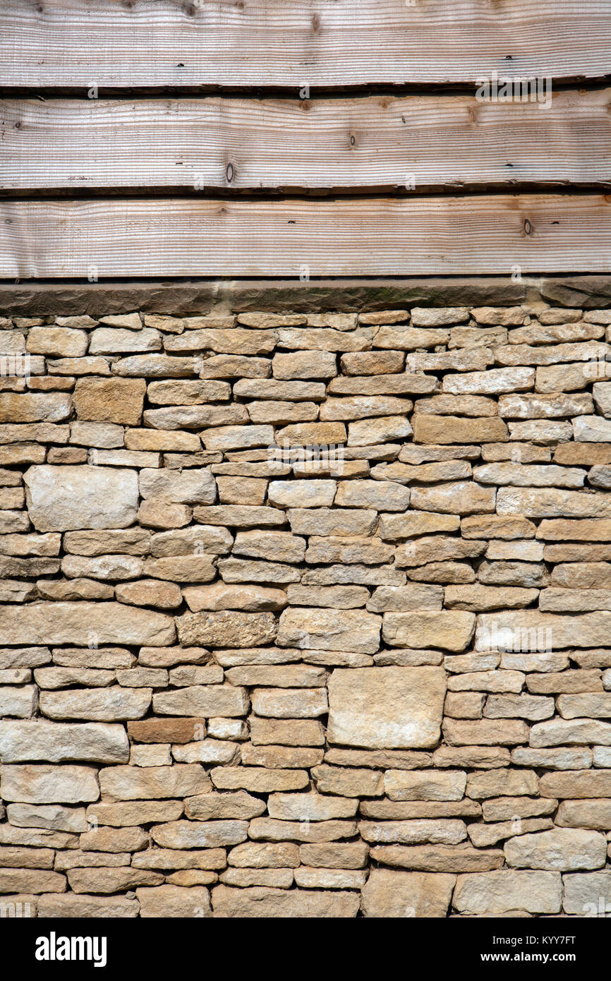 Feather edge timber cladding above a drystone wall Stock Photo - Alamy