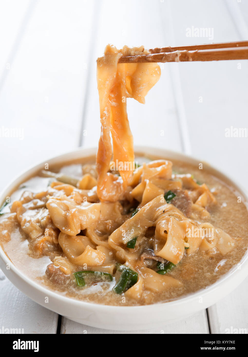 Asian rice based noodles, fried ho fun ready to serve with chopsticks ...