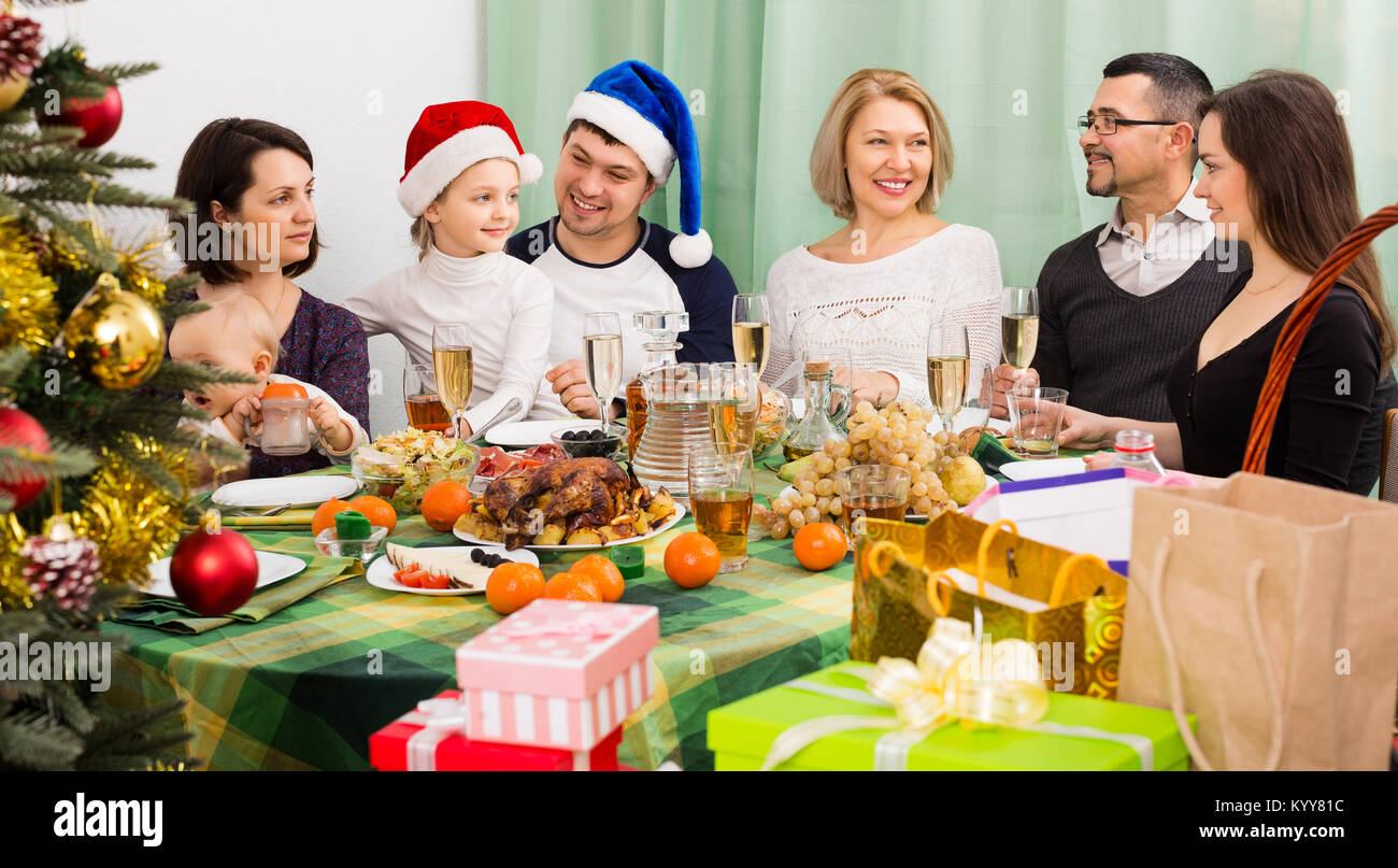 big family celebrates Christmas at table Stock Photo - Alamy
