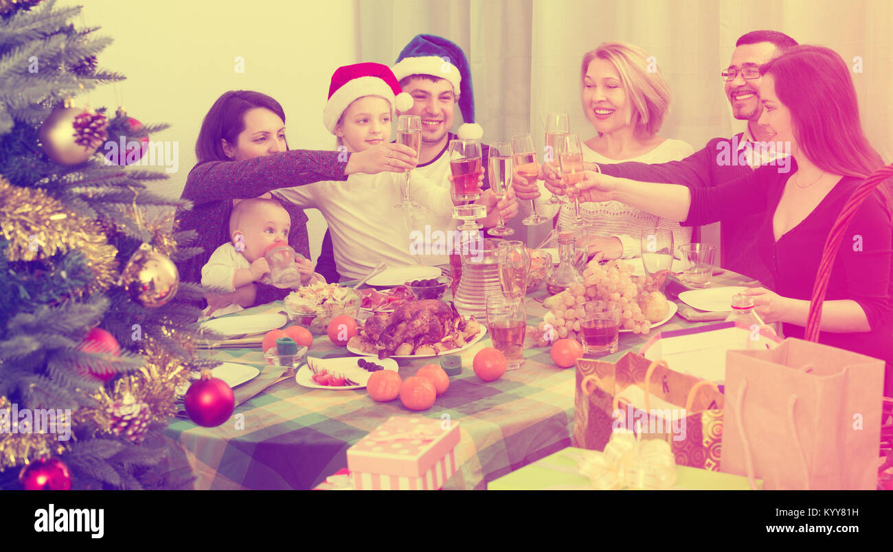 All members family Celebrating Christmas with presents and happiness ...