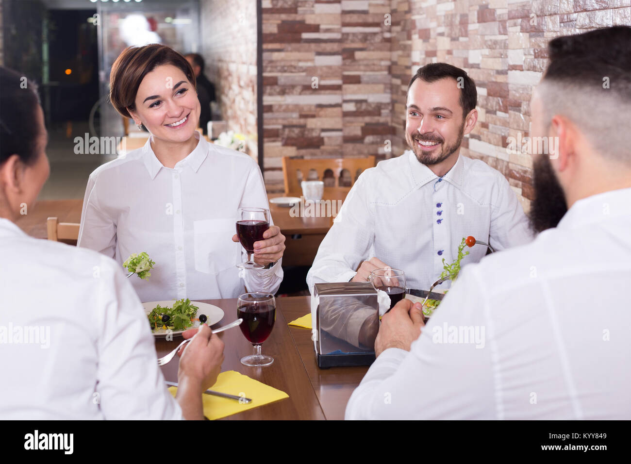 Positive people enjoying dinner in a restaurant Stock Photo - Alamy