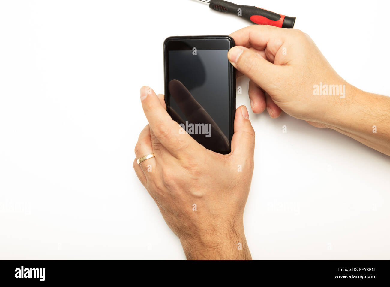 Man replacing a smartphone screen holding the mobile phone in his hand ...