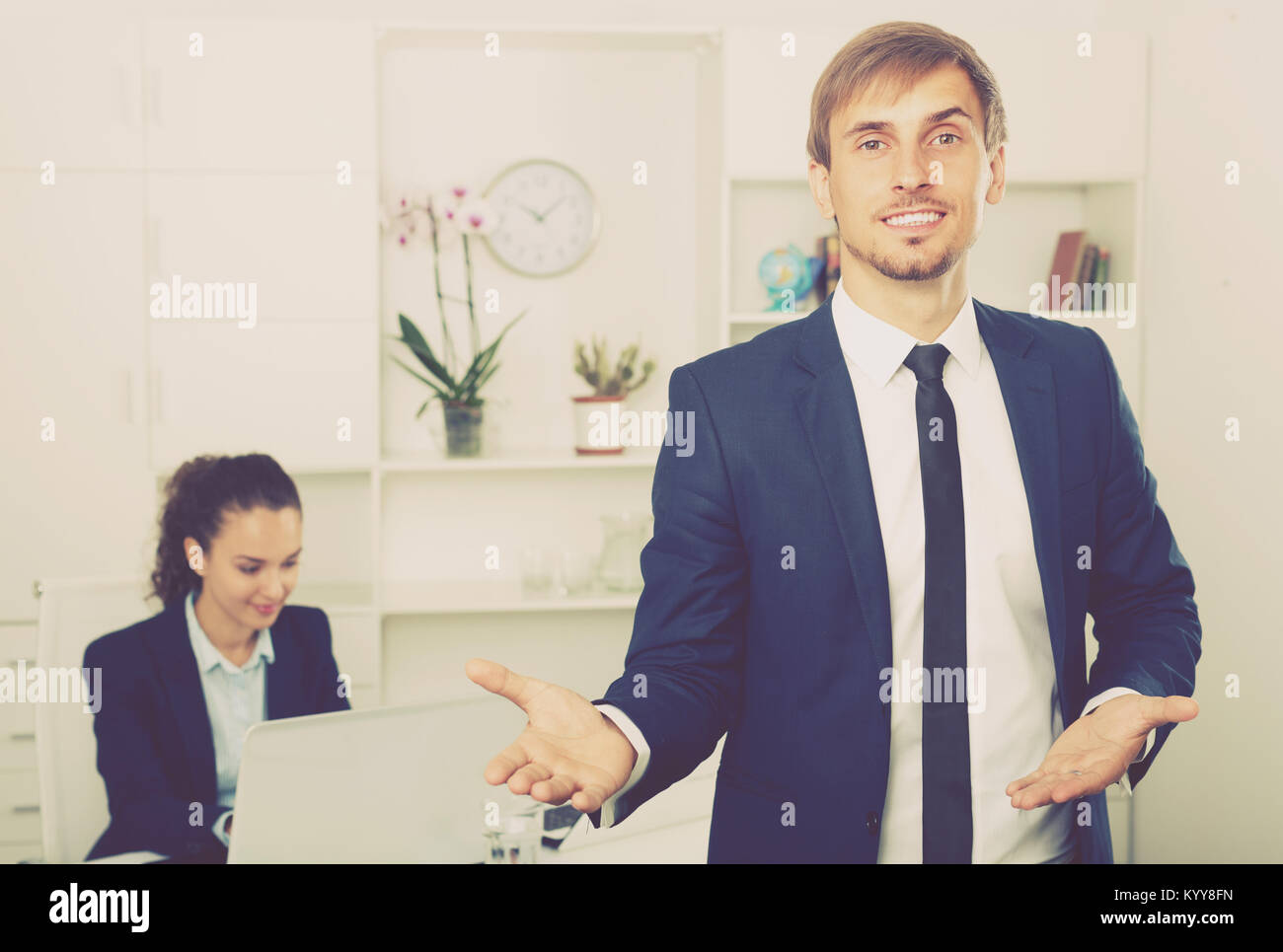 glad business male assistant wearing formalwear standing in company ...