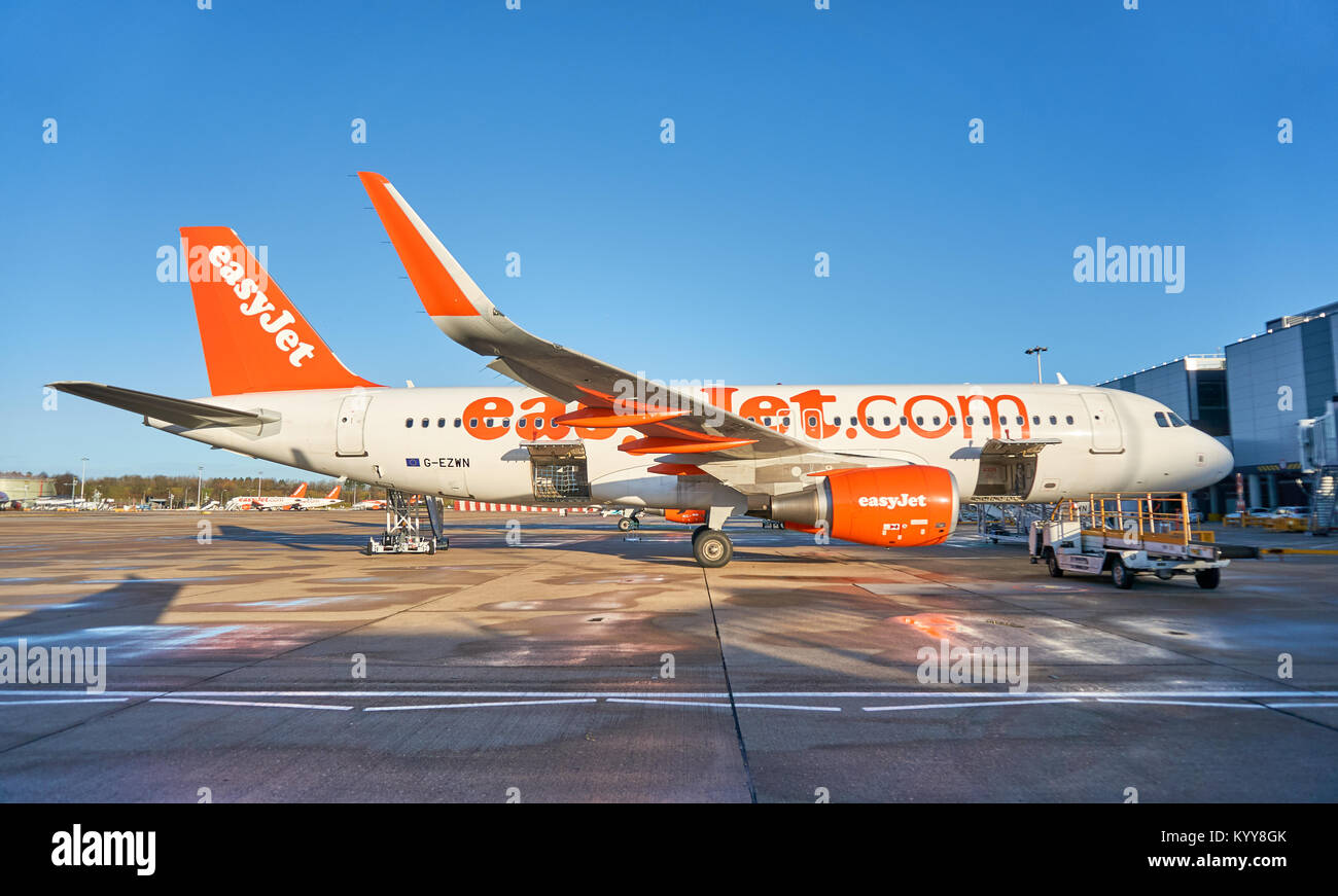 Side view of an Easyjet aircraft on stand at Gatwick Airport, London ...