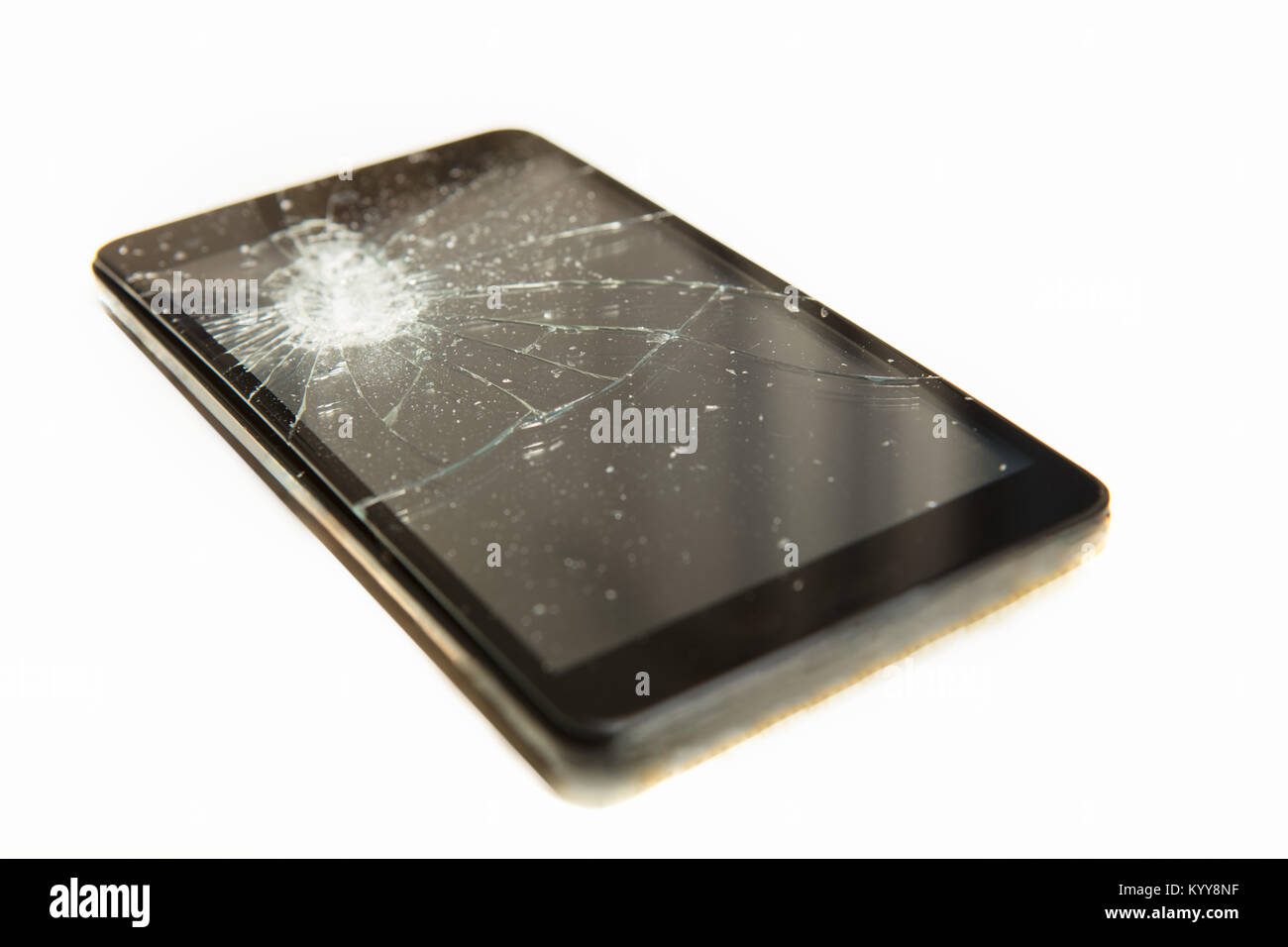 close-up of a black damaged smartphone with broken display on white ...