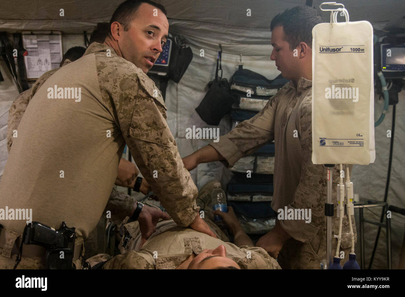 Sailor LCDR Tyler Ensley, left, an Emergency Medicine Physician with ...
