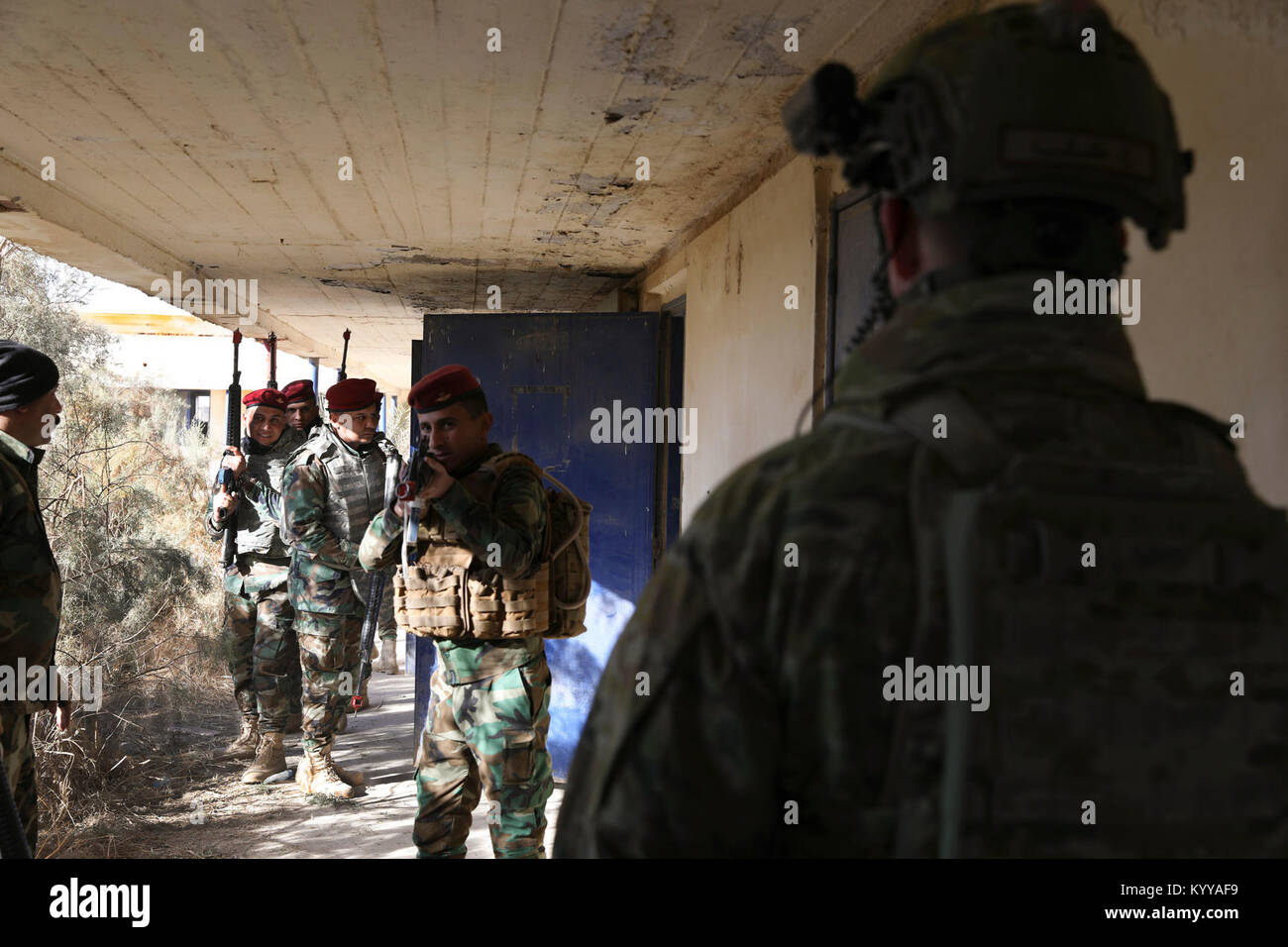 Australian Army Sgt. Nick O’Halloran instructs members of Iraqi Army ...