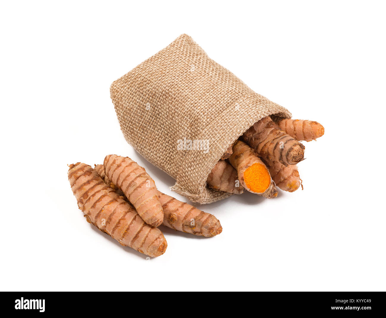 Raw turmeric root in burlap sack isolated on white background Stock ...