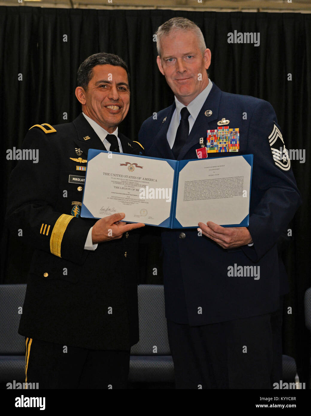 The Adjutant General, New Hampshire National Guard Brig. Gen. David J. Mikolaities, presents the ...