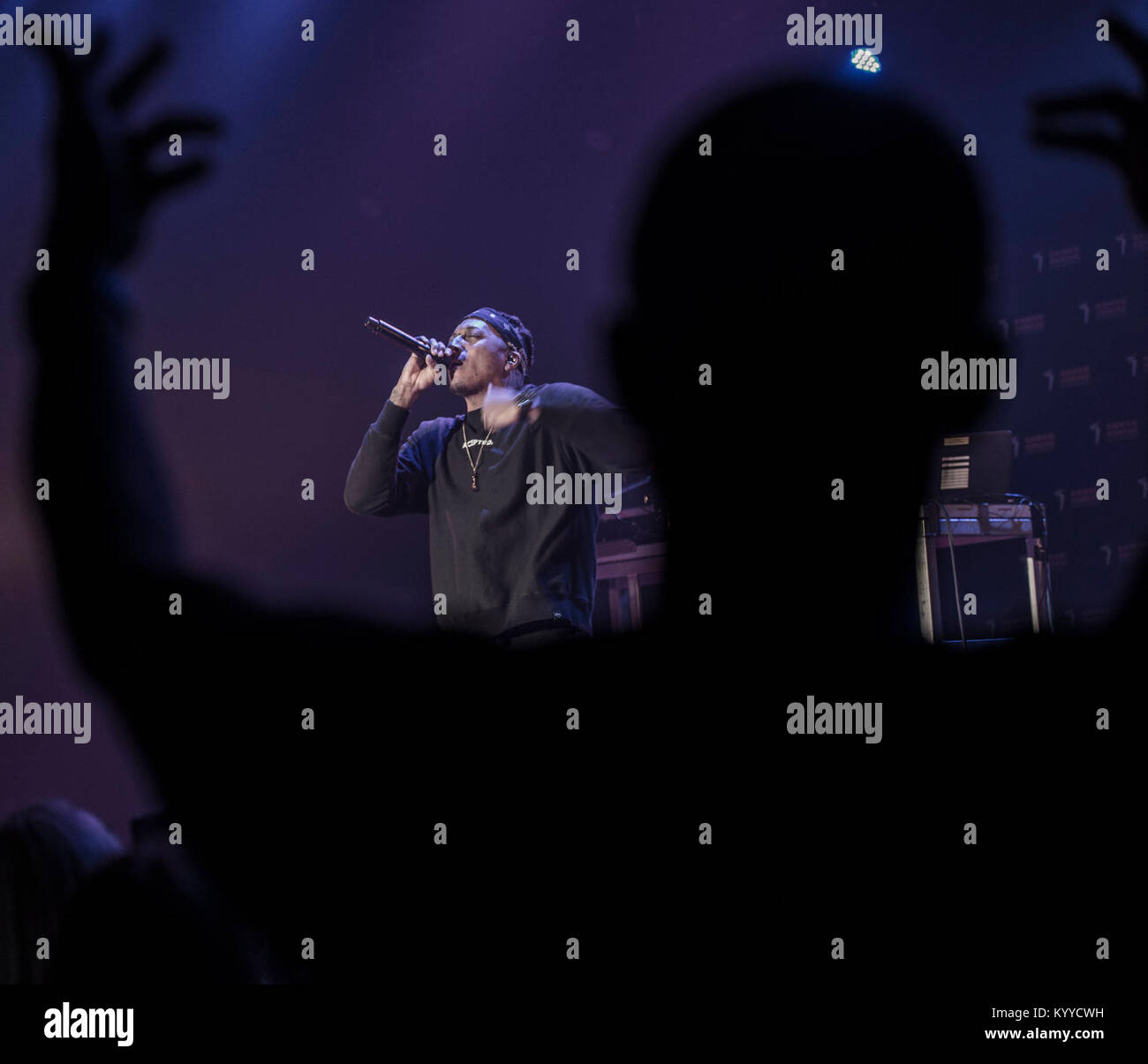 Lecrae, an American Christian hip-hop artist, performs his song ...