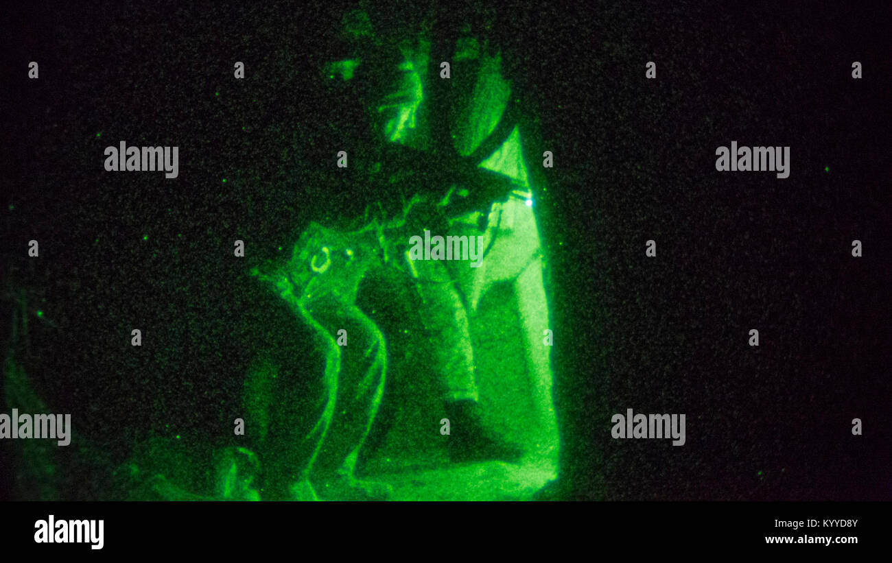 Provincial Special Unit officers search a Taliban compound during a ...