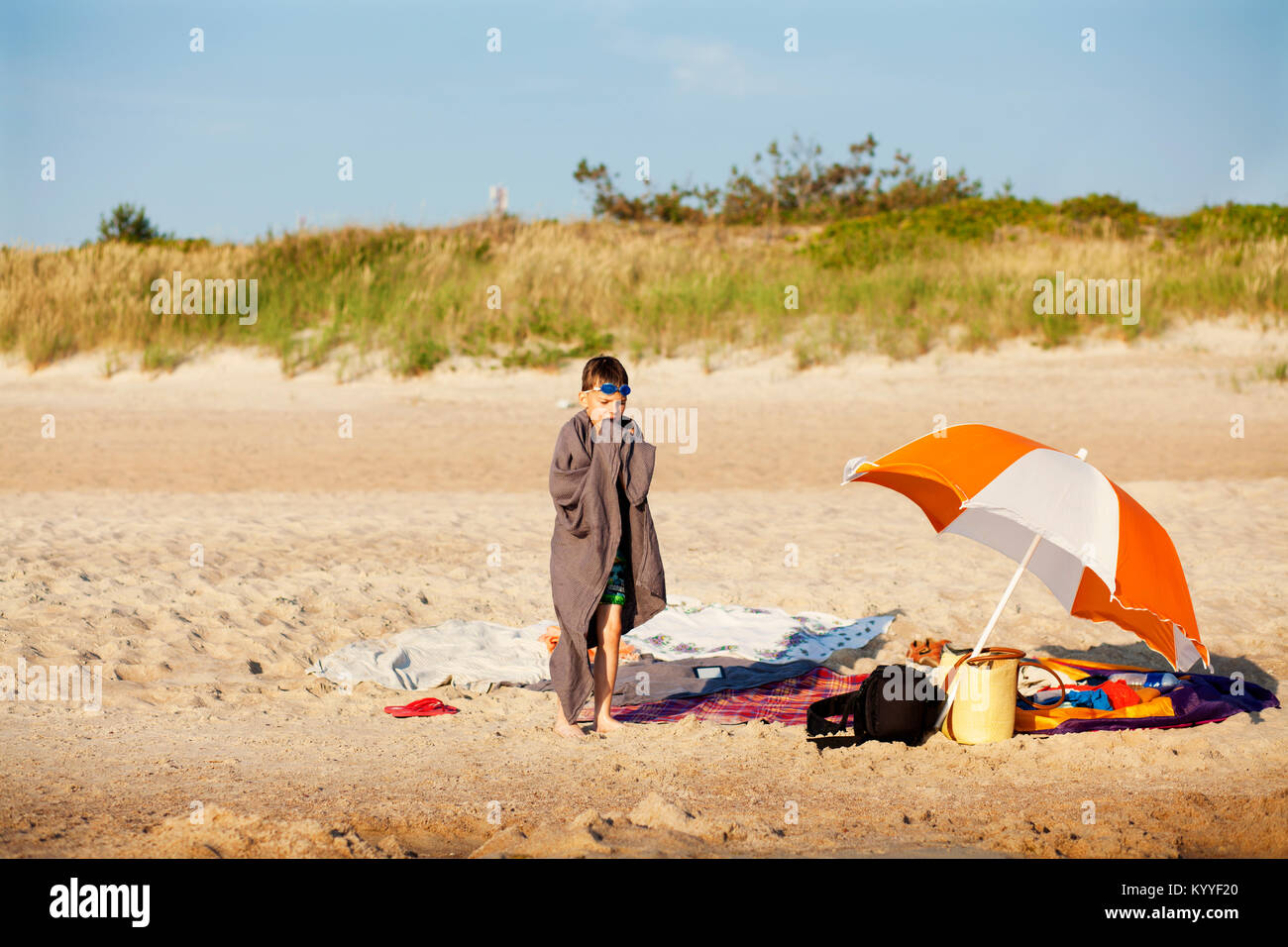 Boy umbrella sand hi-res stock photography and images - Alamy