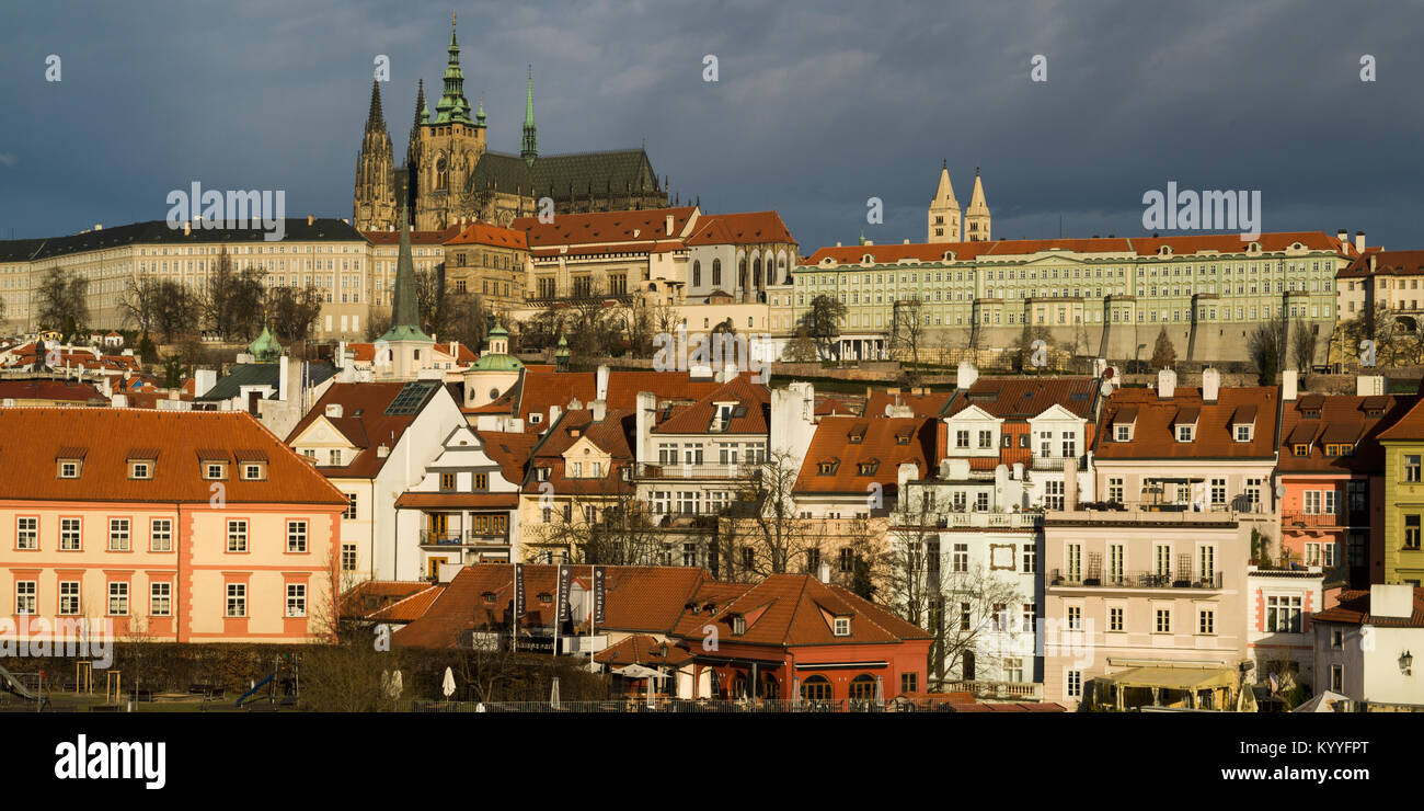 Buildings in city with Prague Castle and St Vitus Cathedral in ...