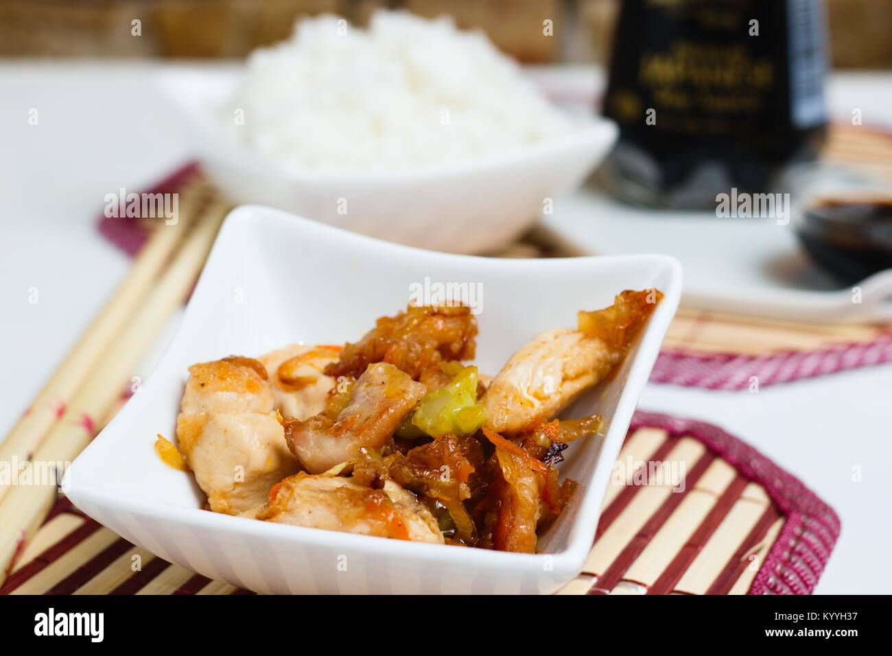 Chinese chopped chicken meat with rice side dish and chopsticks Stock ...