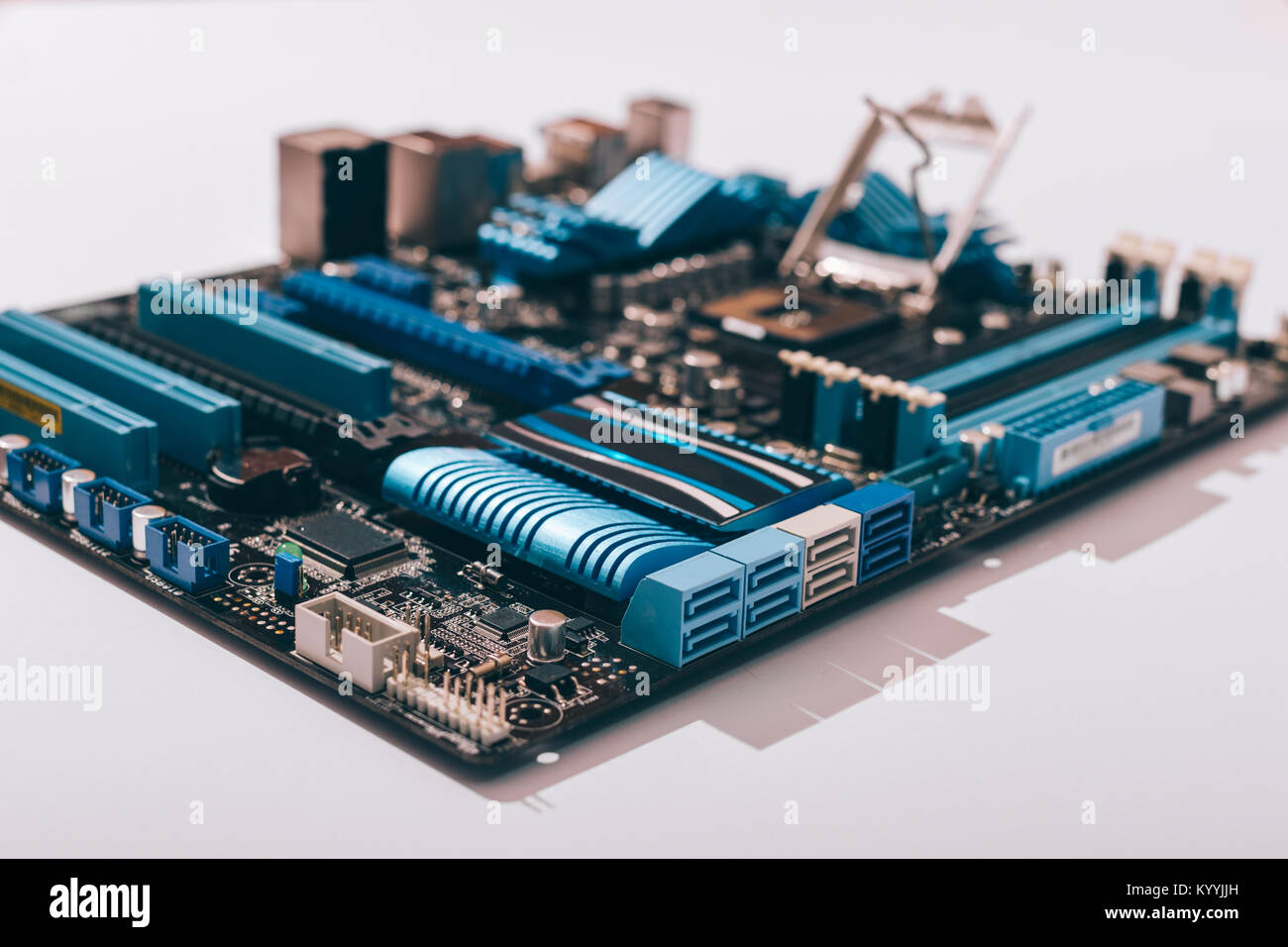 Motherboard on white table close-up, computer details Stock Photo - Alamy
