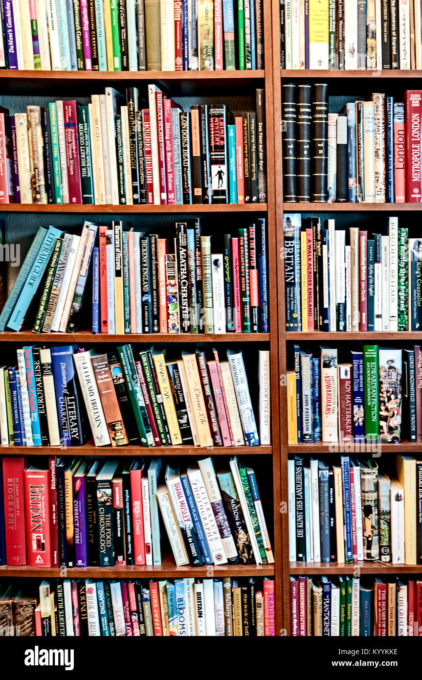Books in a row on shelves; Bücher aufgereiht in einem Regal Stock Photo ...