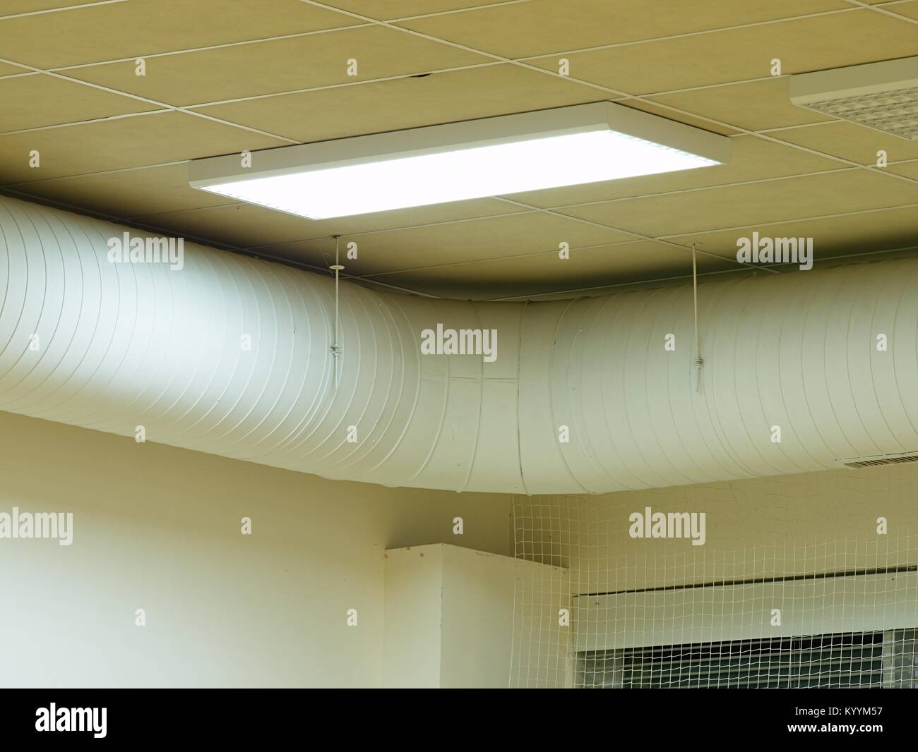 Fluorescent Light Fixture on a White Ceiling. Industrial lighting in ...