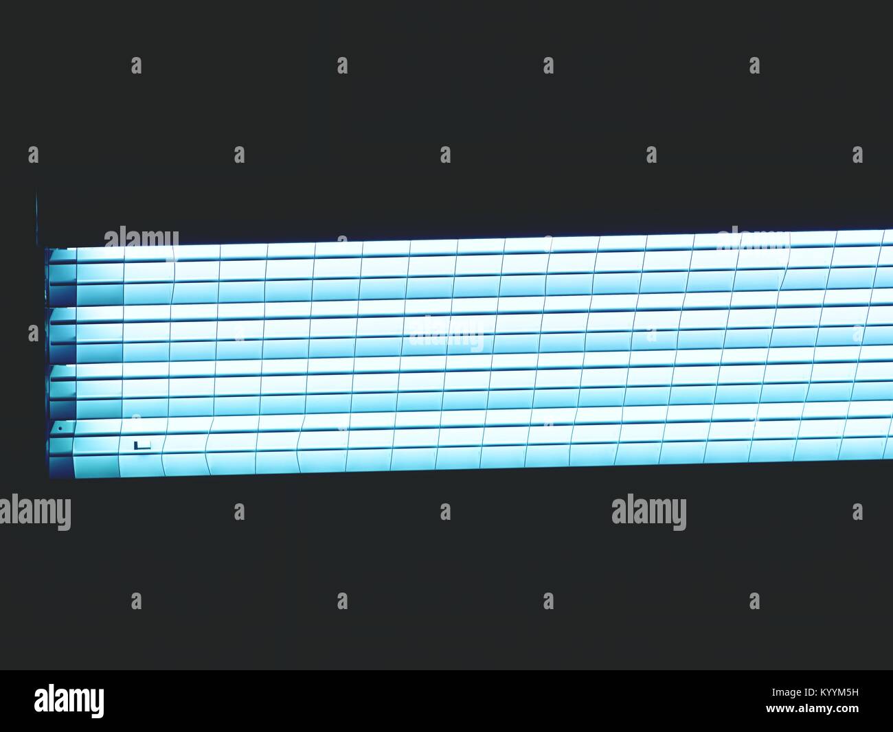 Ceiling of office building with lights. Industry house with blue toned ...