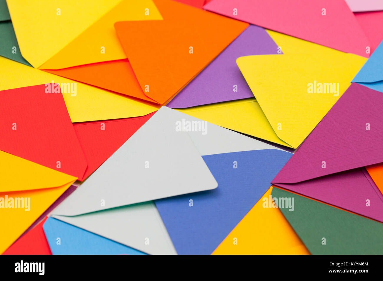 Different colored envelopes on the table Stock Photo - Alamy