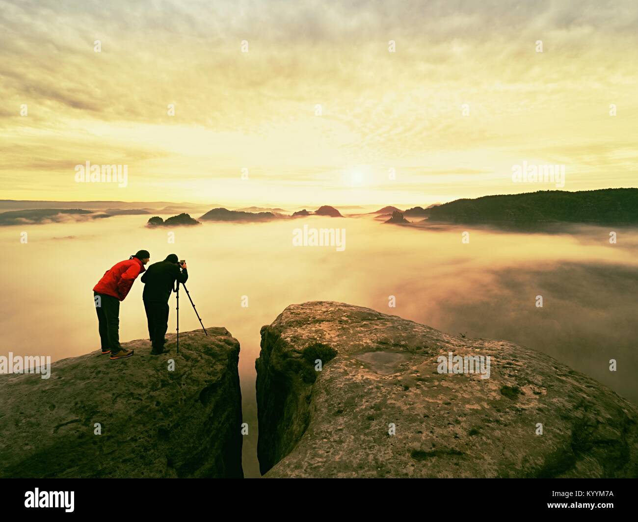 Two men enjoy photographying in wild nature. Nature photographer with ...