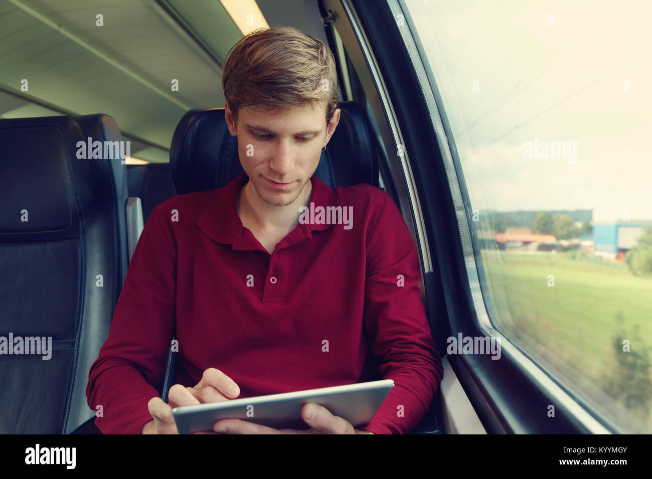 handsome man riding on a train Stock Photo - Alamy