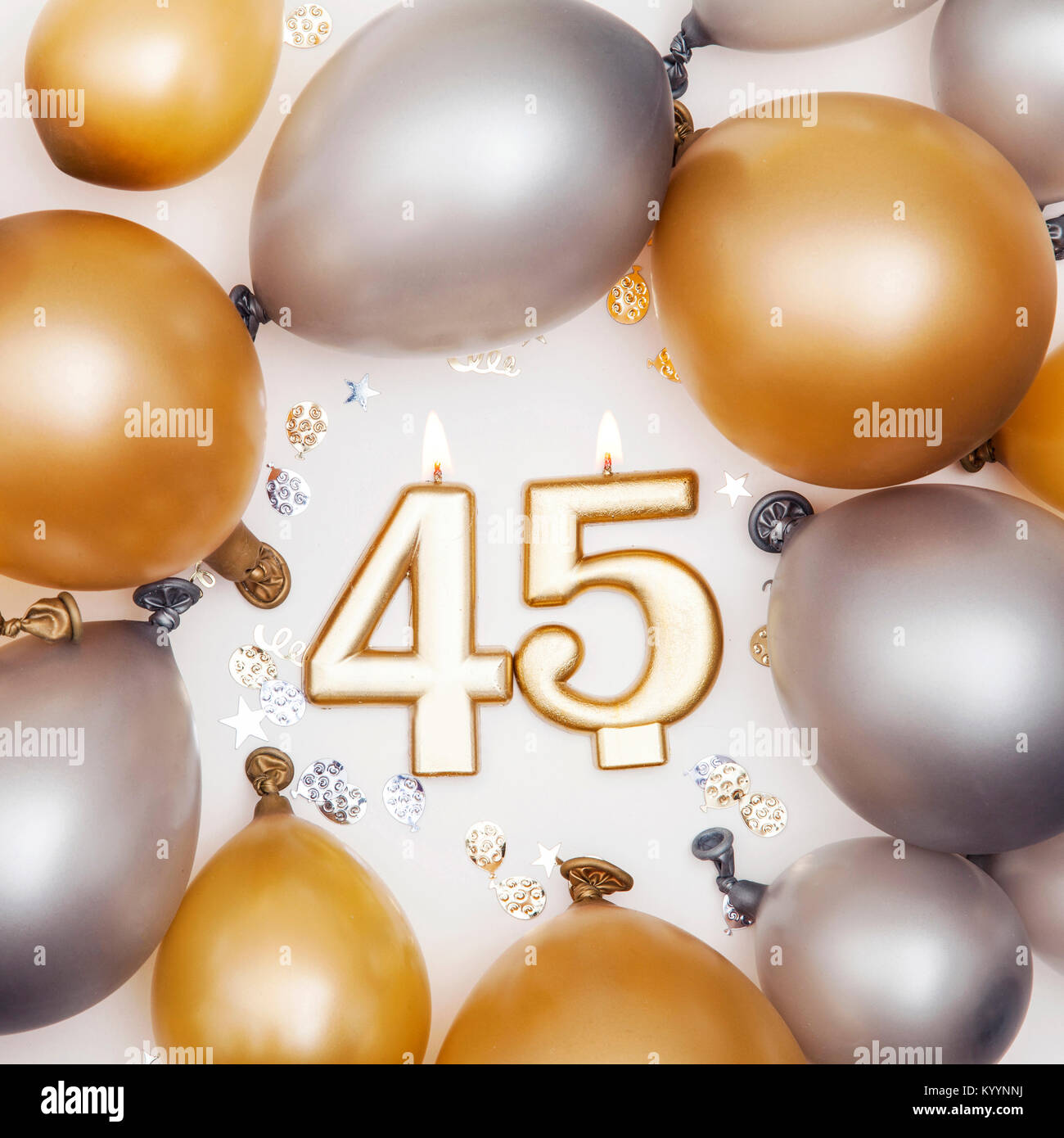 Birthday celebration number 45 candle with gold and silver balloons ...