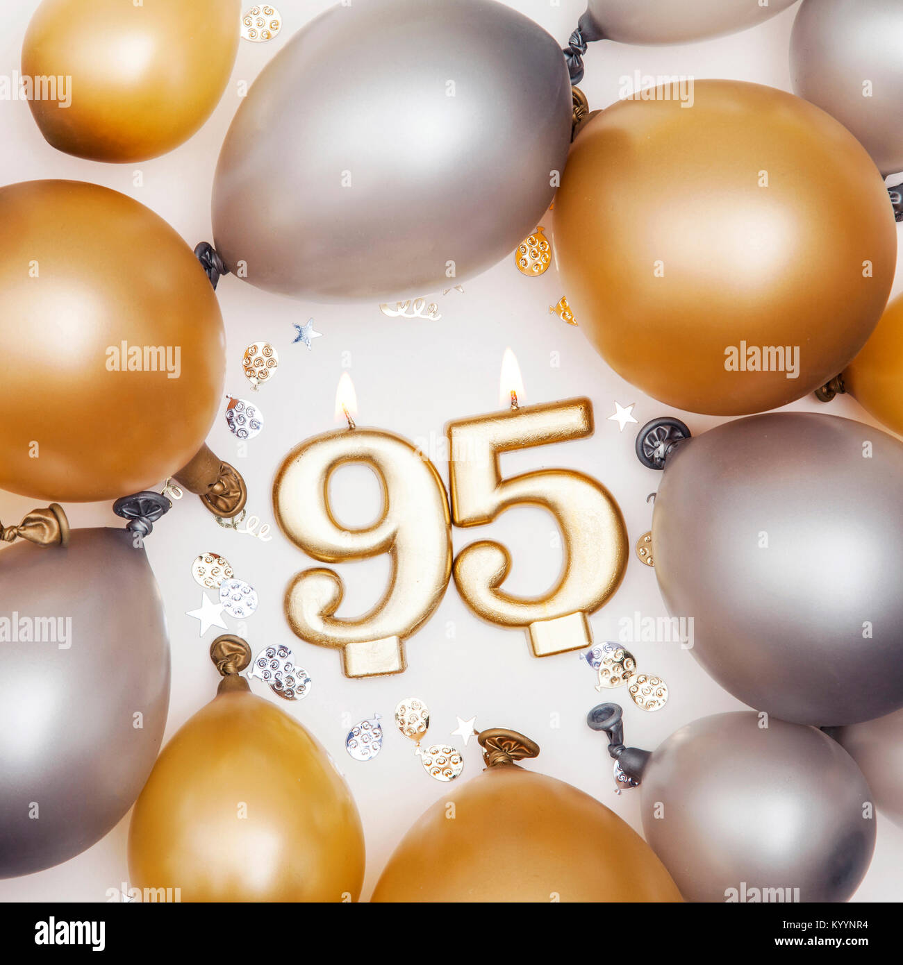 Birthday celebration number 95 candle with gold and silver balloons ...