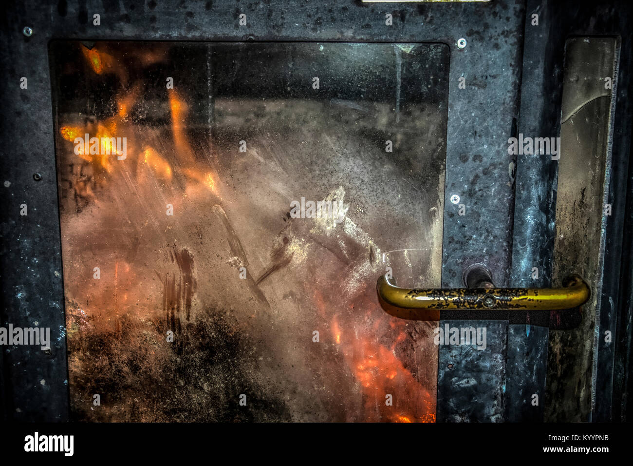 A close-up of a retro furnace with a burning fire Stock Photo - Alamy