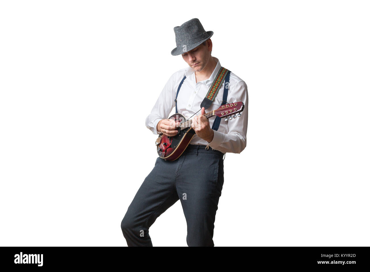 Man wearing hat is concentrated playing the mandolin Stock Photo - Alamy