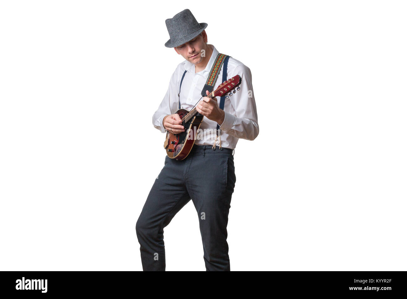 Man wearing hat is concentrated playing the mandolin Stock Photo - Alamy