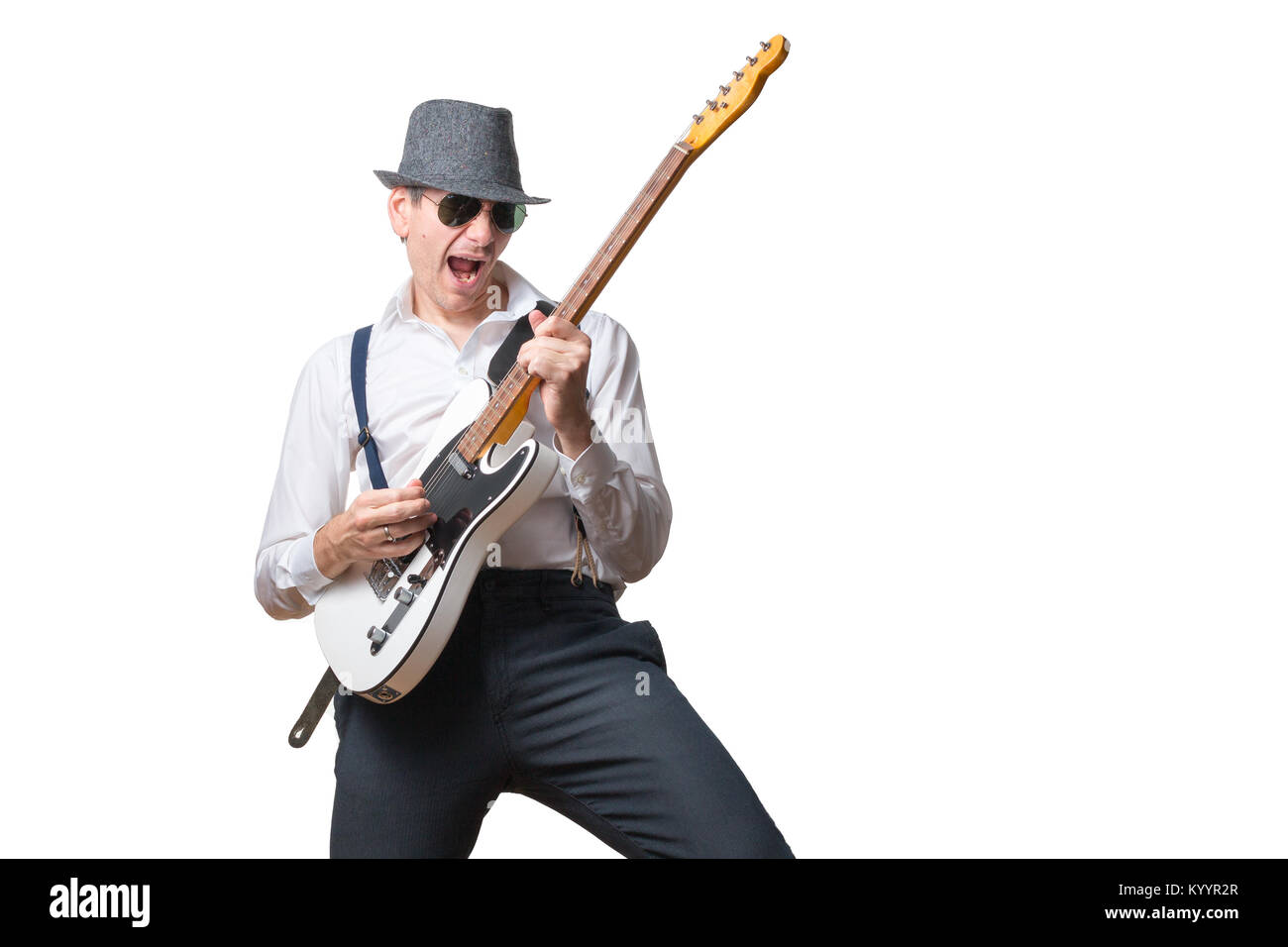 Man with hat and sunglasses plays electric guitar and sings Stock Photo ...