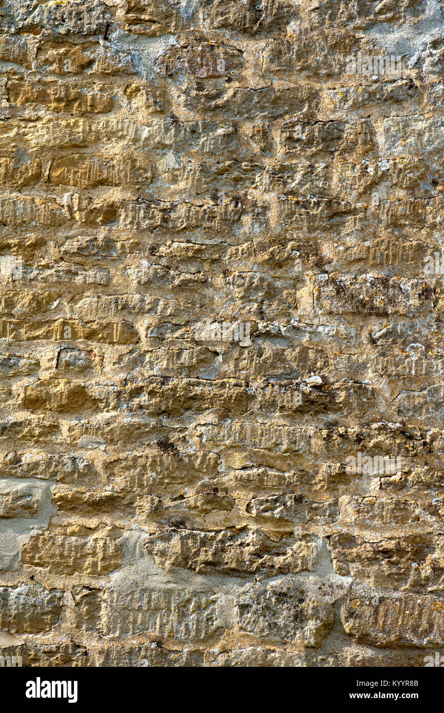 Old lichen covered limestone wall background texture Stock Photo - Alamy