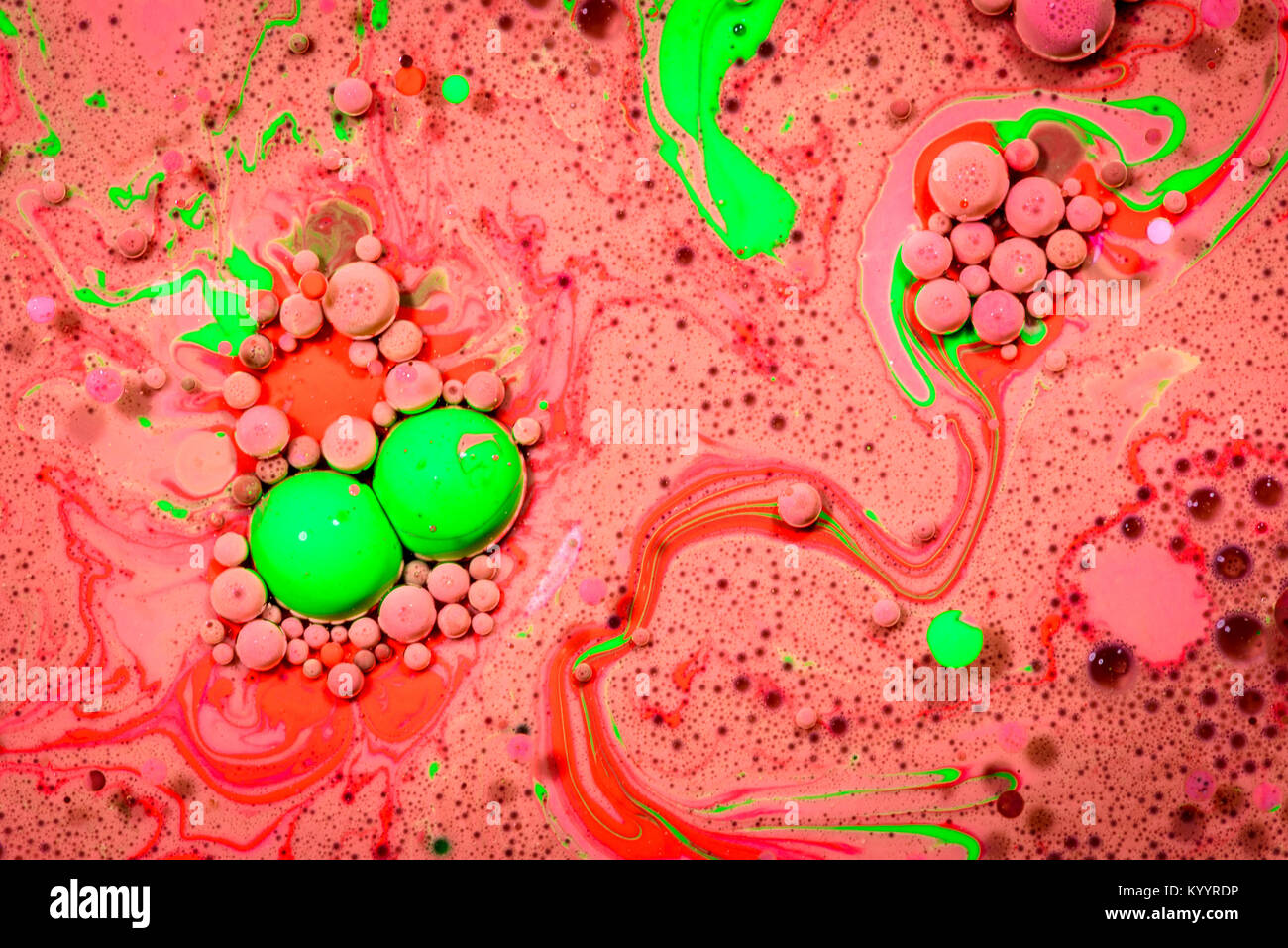 Toxic chemical acrylic oil droplets on water creating the idea of ...