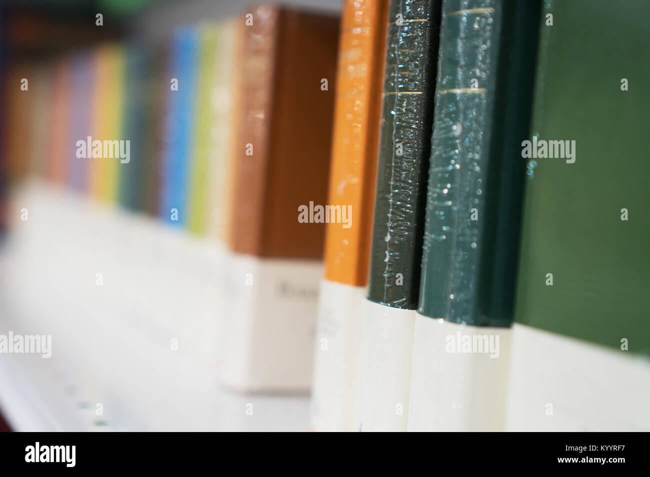 Blurred books on shelf in bookstore Stock Photo - Alamy