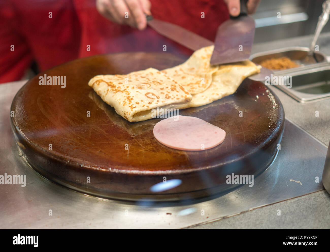 Preparation of pancake. Cook works in the kitchen Stock Photo - Alamy