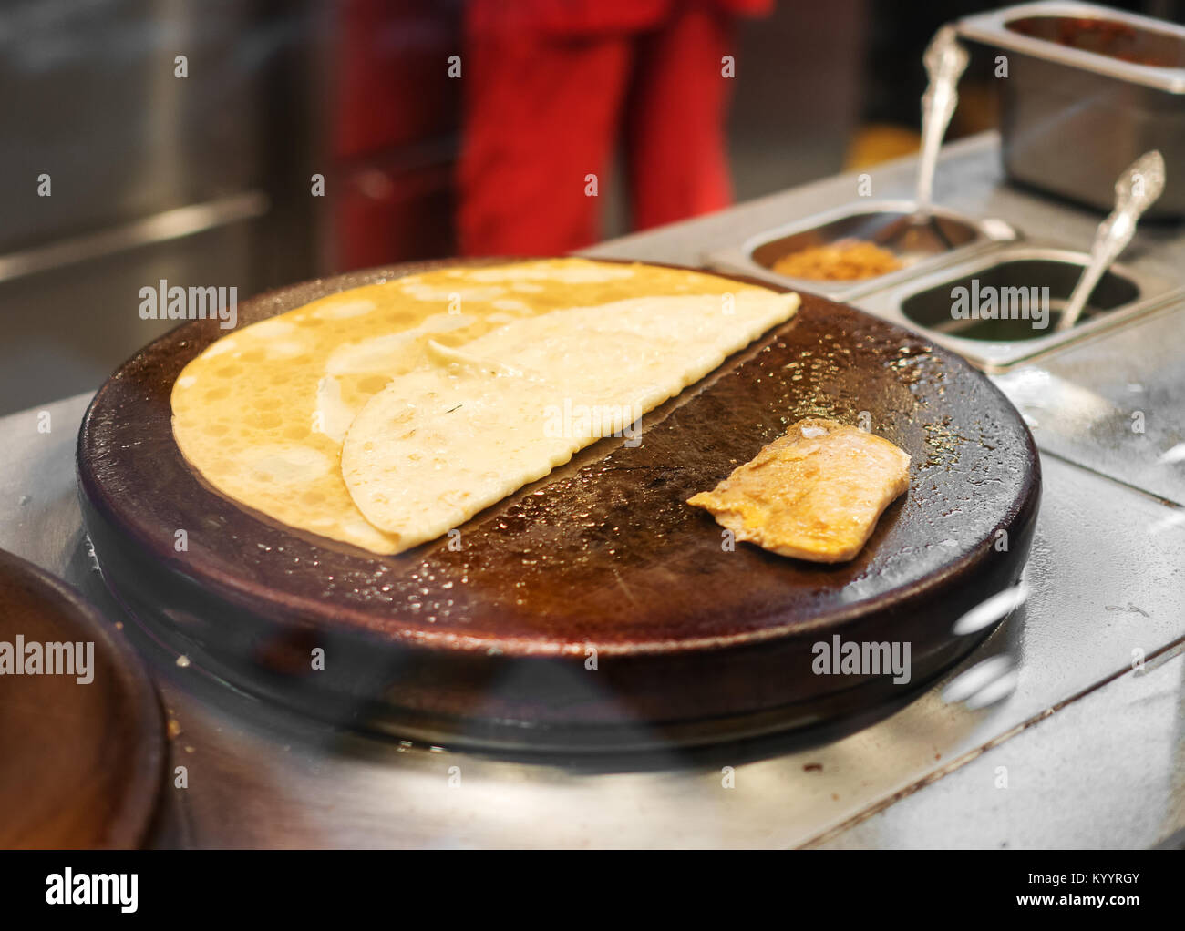 Preparation of pancake. Cook works in the kitchen Stock Photo - Alamy