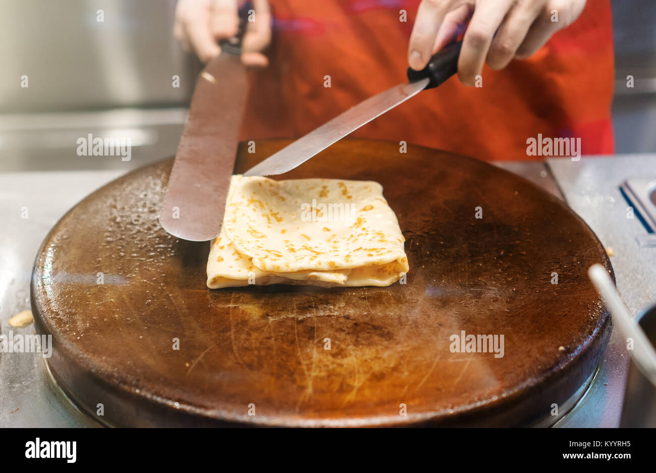 Preparation of pancake. Cook works in the kitchen Stock Photo - Alamy