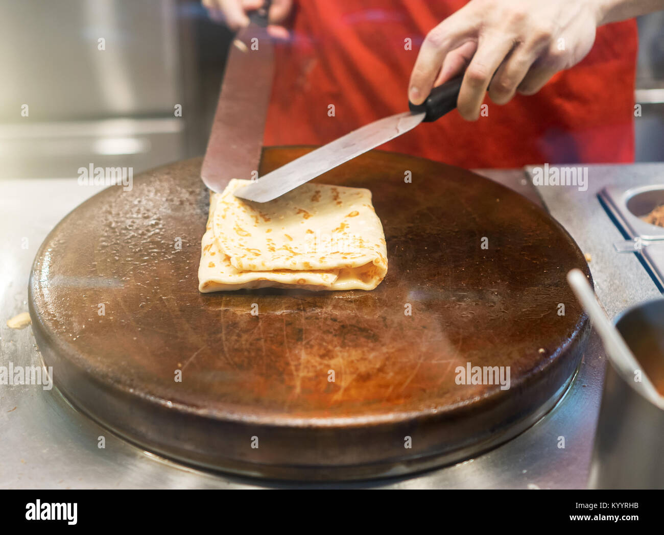 Preparation of pancake. Cook works in the kitchen Stock Photo - Alamy