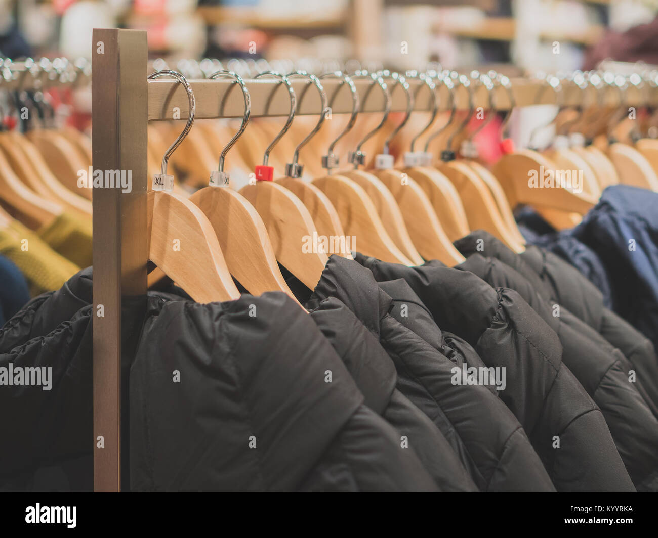 Collection of winter jackets in clothing store Stock Photo - Alamy