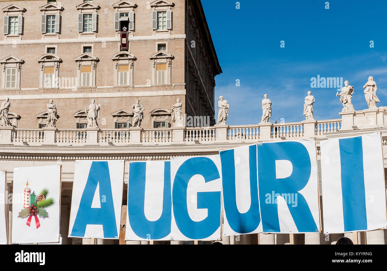 Faithful hold placards reading "Best Wishes Her Holiness" on the ...