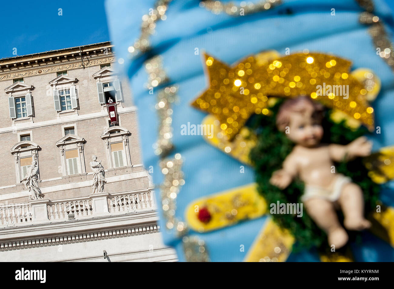 A statue of baby Jesus as Pope Francis leads his Sunday Angelus prayer ...
