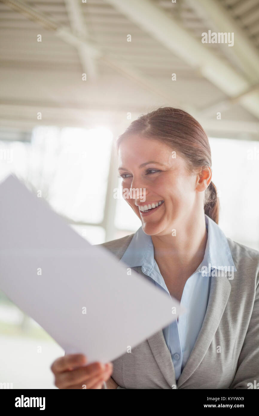 Woman passing paper office hi-res stock photography and images - Alamy