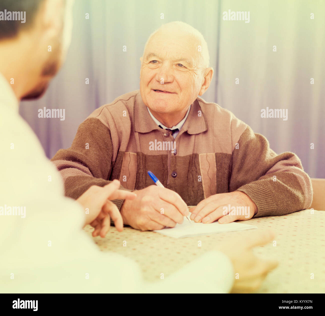 Old man and social department manager fill in questionnaire Stock Photo ...